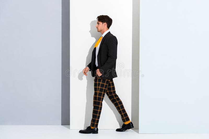 Side view of man walking stock photo. Image of posing - 203699248