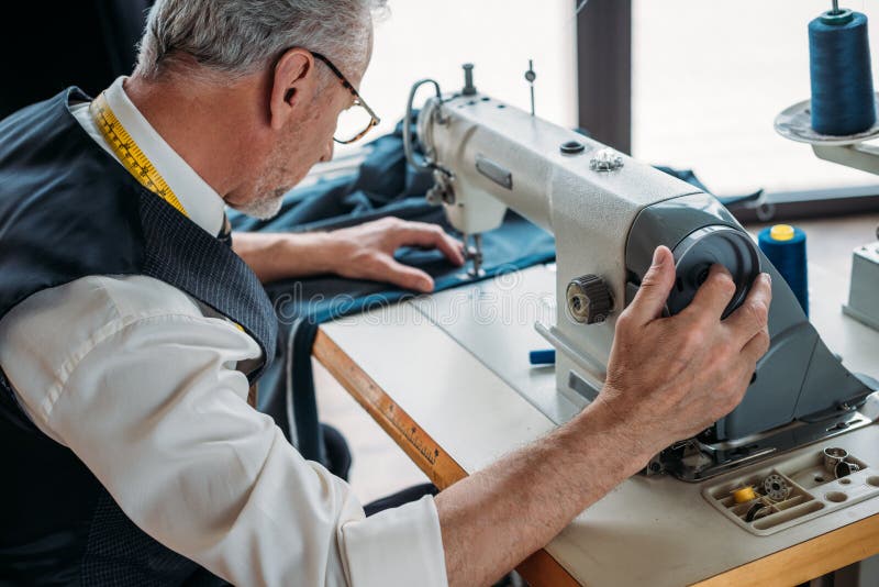 Side View of Tailor Sewing Cloth with Sewing Machine Stock Image ...