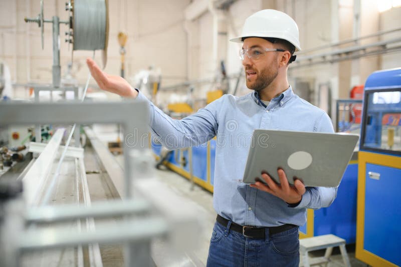 Side View of Technician or Engineer with Headset and Laptop Standing in ...