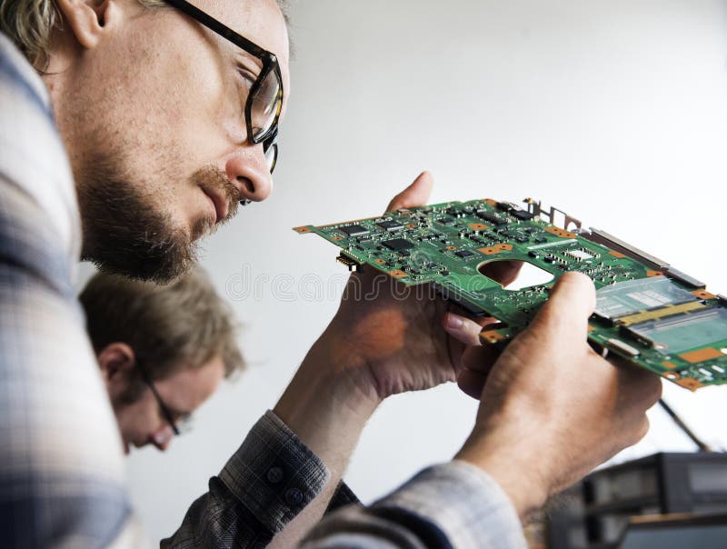 Side View of Technician Working on Computer Mainboard Stock Photo ...