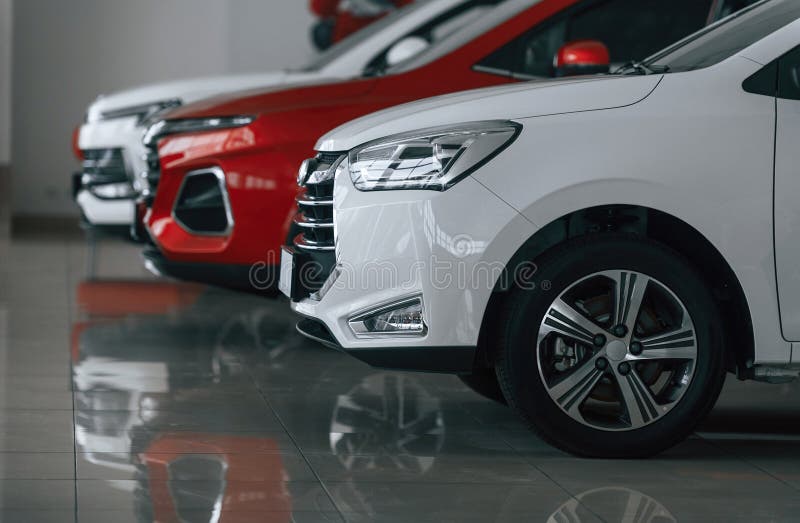 Side View of Three Cars that are Parked in the Auto Salon Stock Photo ...