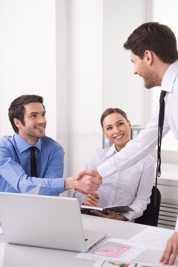 Side View of Three People Working on Computer at Office. Stock Photo ...