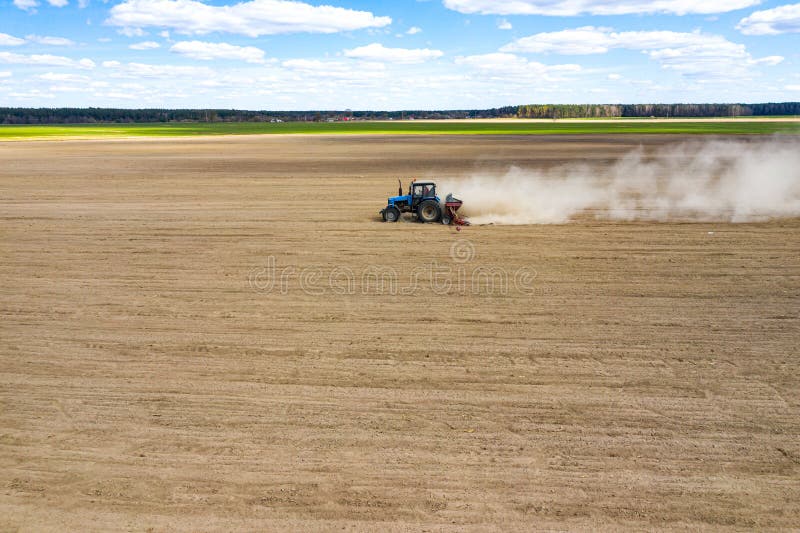Side View of Tractor Planting Corn Seed in Field, High Angle View Drone ...