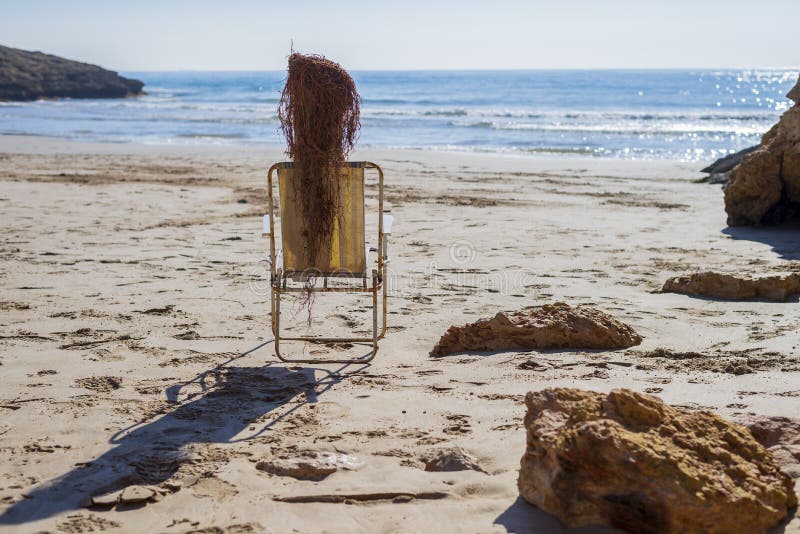 Side View of a Trunk Doll on Beach Chair Simulating a Person Sunbathing ...