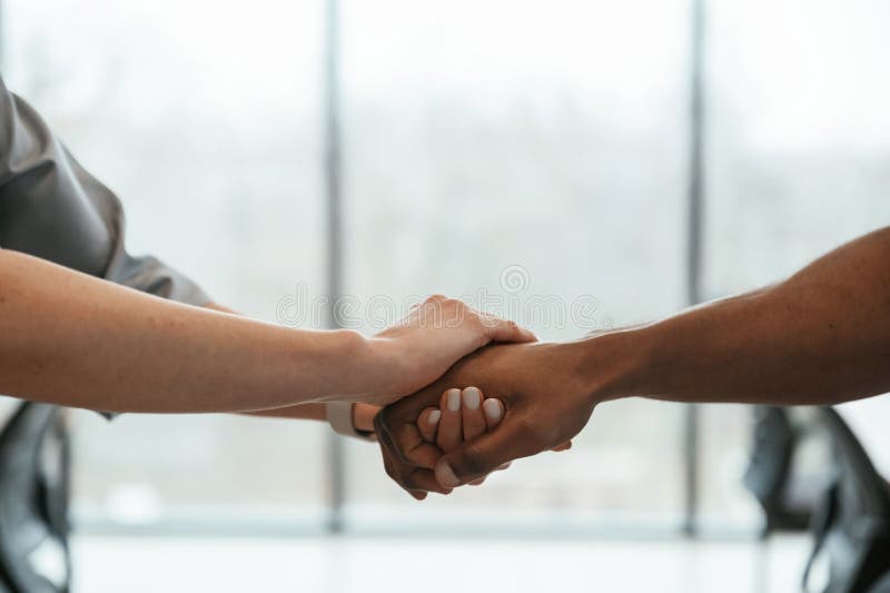 Side View. Two Doctors are Holding Hands Indoors Stock Photo - Image of ...
