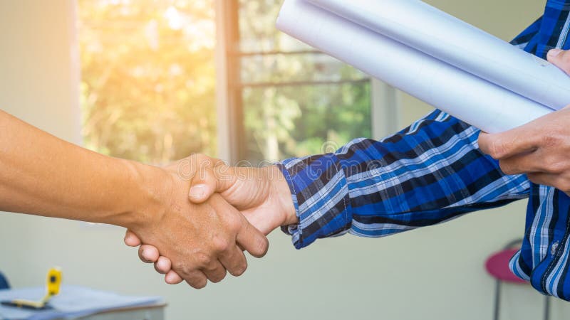 Engineers shaking hands stock photo. Image of businessperson - 5995892
