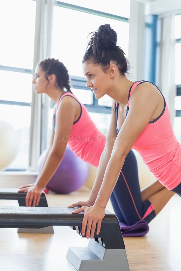 Side View of Two Fit Women Performing Step Aerobics Exercise Stock ...