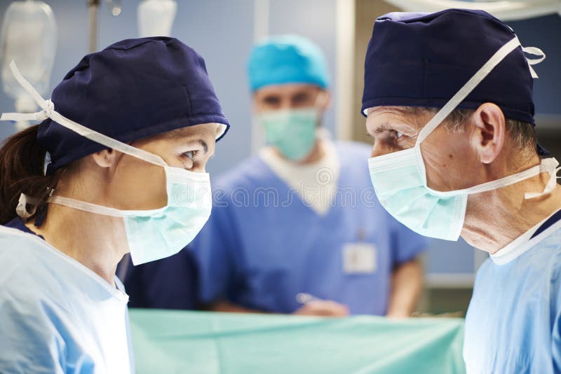 Side View of Two Surgeons Having Conversation Stock Image - Image of ...