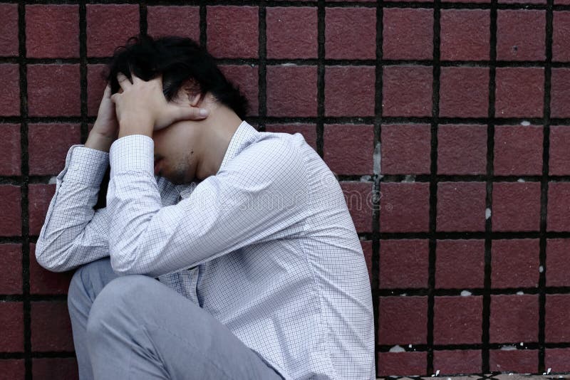 Side View of Unhappy Depressed Young Asian Man Sitting and Feeling Bad ...
