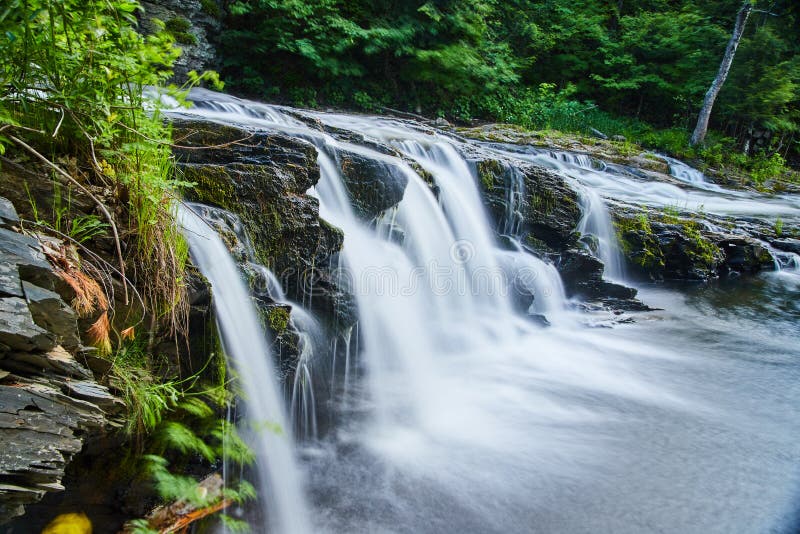 Side View Up Close of Waterfalls Cutting through Rock Points in Forest ...