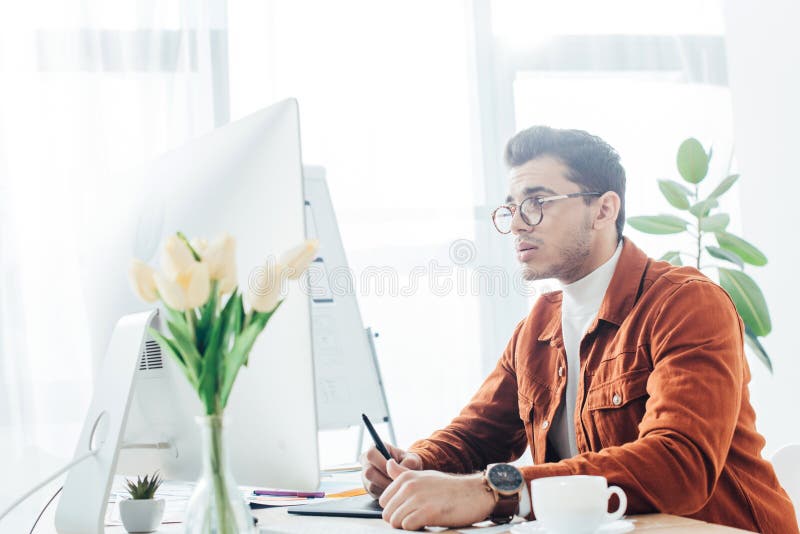 Side View of Ux Designer Working with Computer and Graphics Tablet on ...