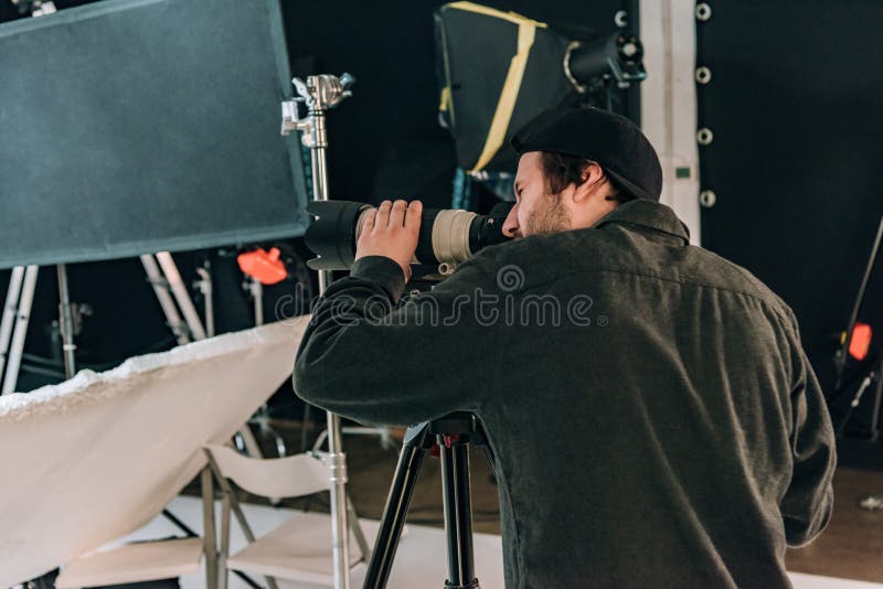 View of Videographer with Camera and Reflectors at Background Stock ...