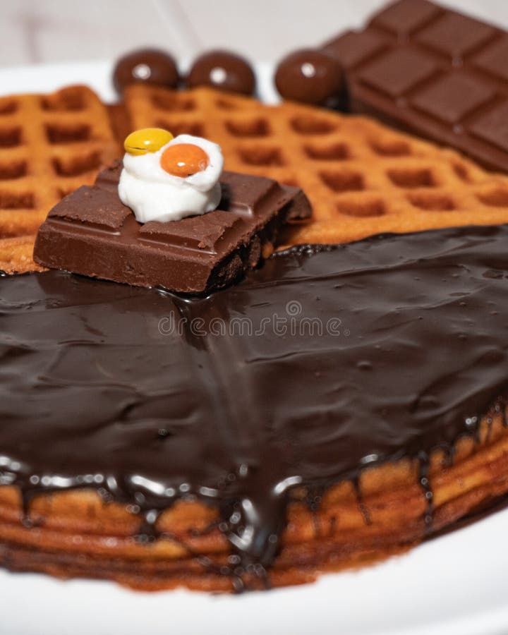 Side View of a Waffle with Chocolate Syrup As the Inside and a Candy As ...