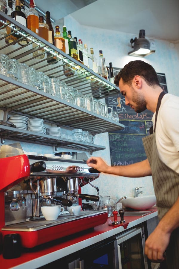 Side View of Waiter Using Coffee Maker at Cafe Stock Photo - Image of ...