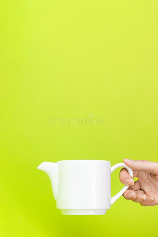 Side View of White Ceramic Teapot in Hand. Tea Preparation Minimal ...