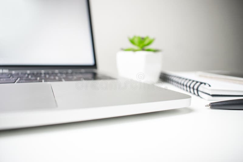 Side View, White Desk with Laptop, Notebook and Pen. Top View with Copy ...
