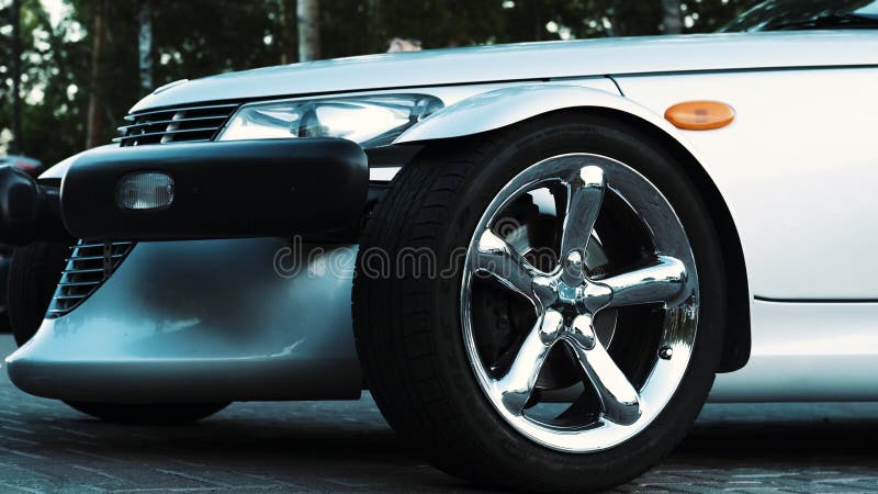 Side View of a White Unusual Car and a Stylish Wheel Stock Image ...