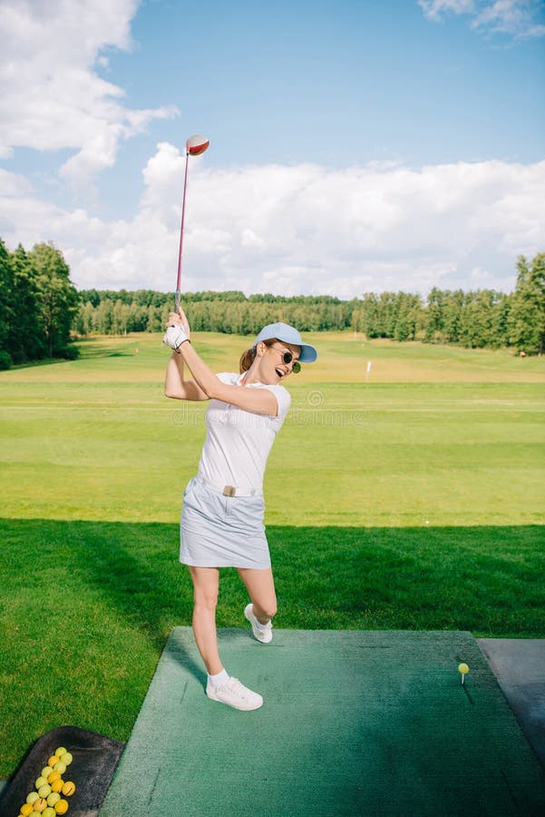 Side View of Woman in Polo Sunglasses and Cap Playing Golf Stock Photo ...
