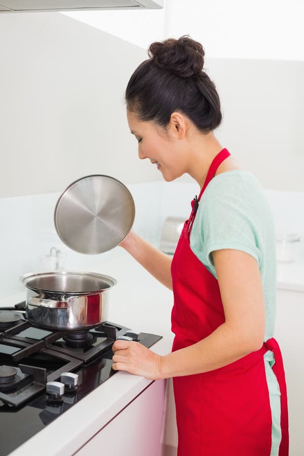 Side View of a Woman Preparing Food in Kitchen Stock Image - Image of ...