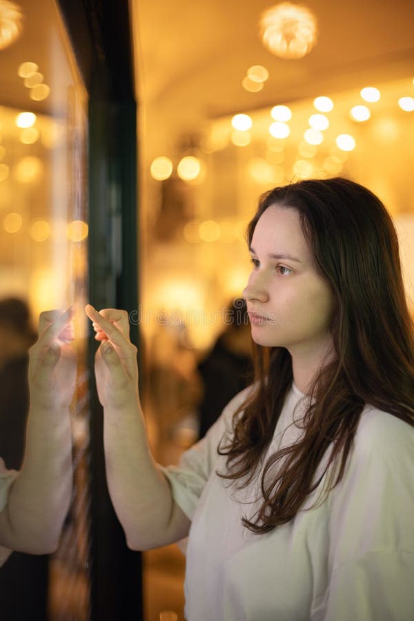 Side View of a Woman Using Touch Screen Terminal, an Exhibition or ...