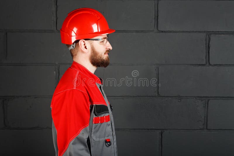 Side View of Worker Wearing Overalls and Red Helmet and Protecti Stock ...