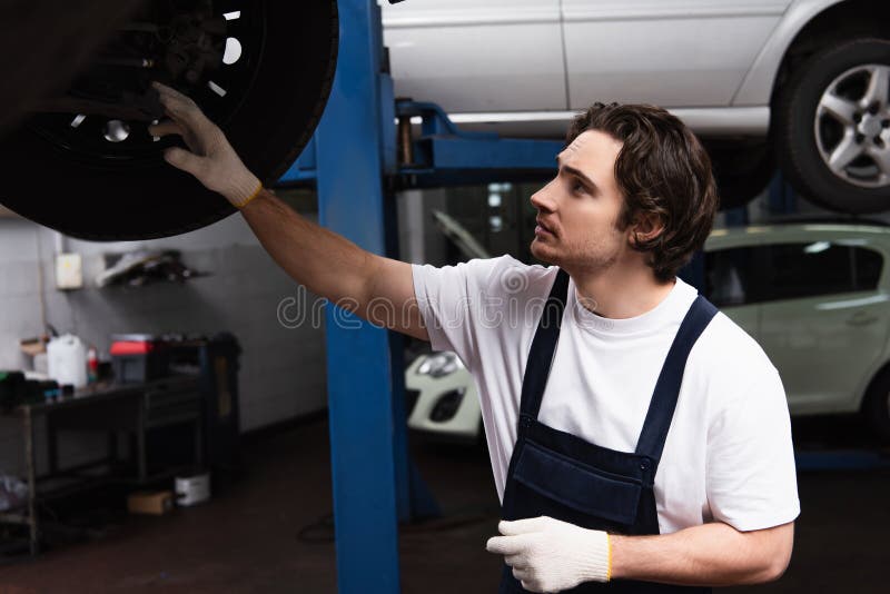Side View of Workman Checking Car Stock Photo - Image of repairman ...