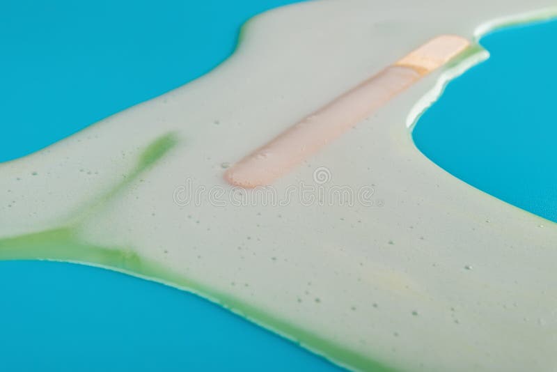 Side View Yellow Popsicle Melting Completely on Blue Stock Photo ...