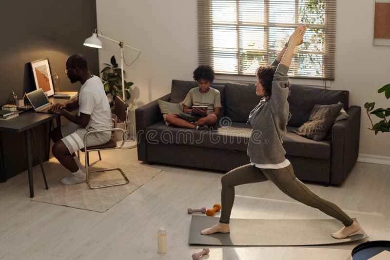 Side View of Young Active Woman Practicing Stretching Exercise on Mat ...