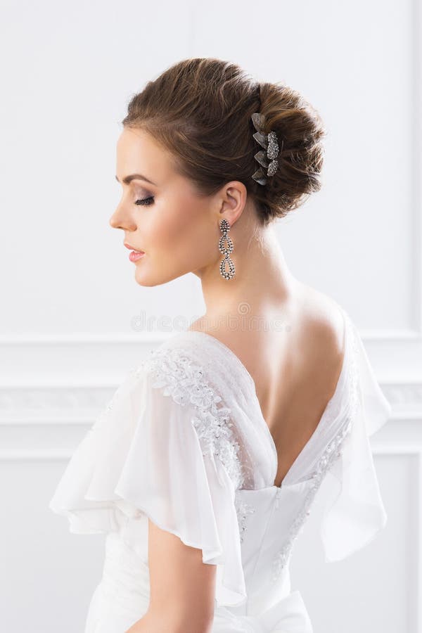 Side View of Young and Beautiful Bride in White Dress Stock Photo ...