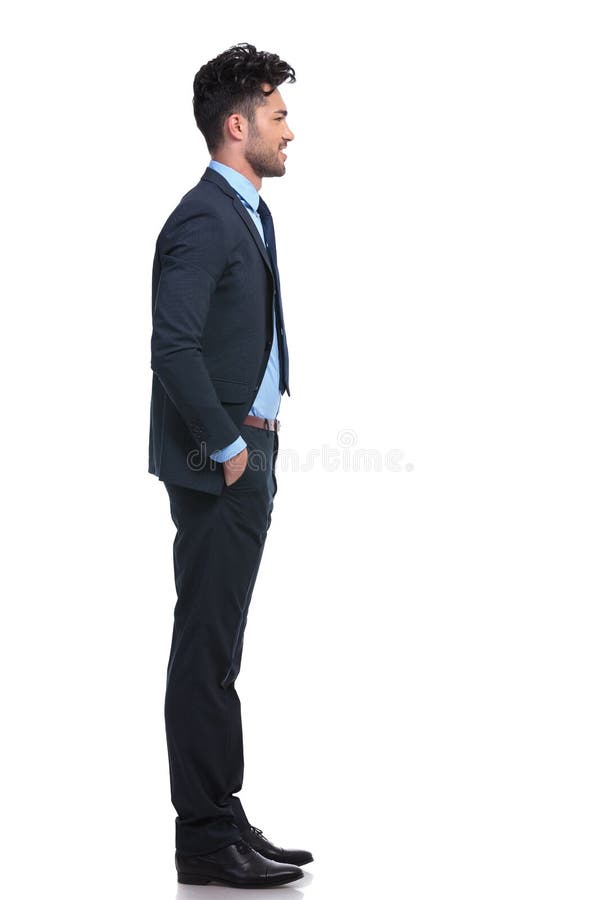 Side View of a Young Business Man with Hands in Pockets Stock Photo ...