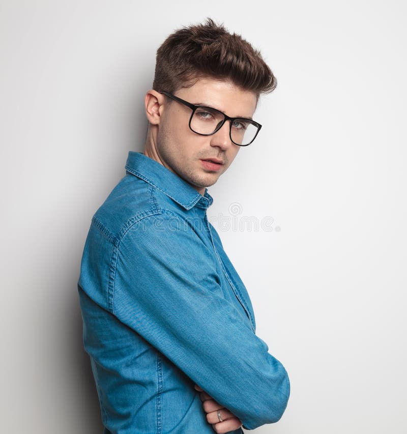 Side View Of Young Casual Man Standing With Arms Folded Stock Photo ... Side View Of Young Casual Man Standing With Arms Folded Stock Photo ...