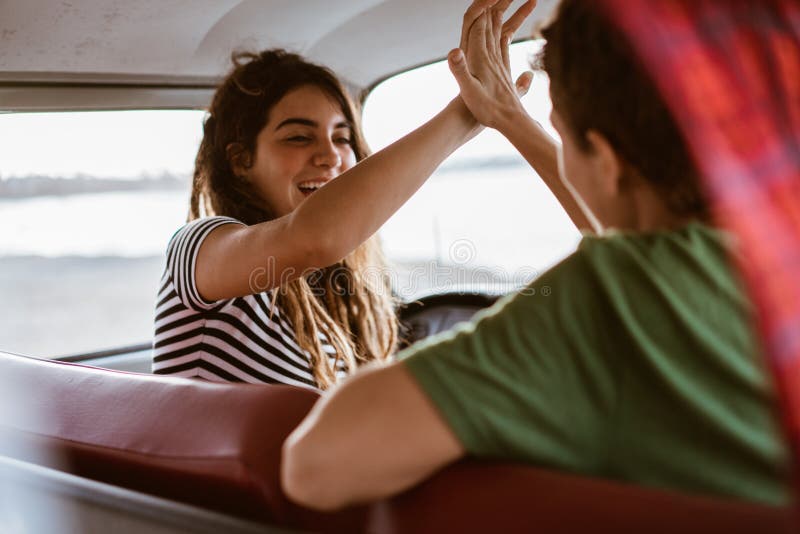 Side View Young Couple High Five Inside Car Stock Image - Image of ...