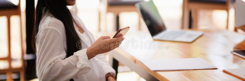 Side View of Young Female College Student Using Smartphone Stock Image ...