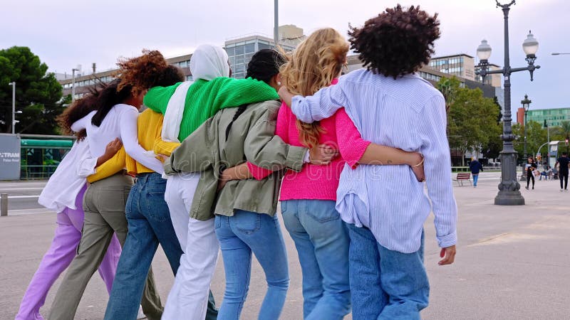 Young Diverse Group of Happy Women Walking Together at City Street ... Young Diverse Group of Happy Women Walking Together at City Street ...