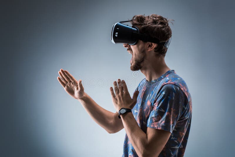 Side View of a Young Guy Using a VR Headset. Emotions Stock Image ...