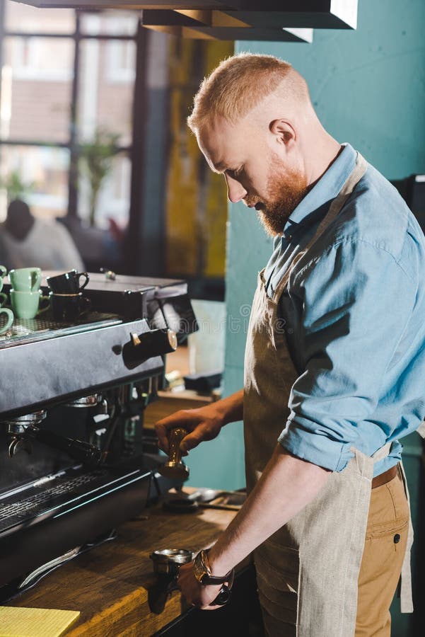 Side View of Young Male Barista Using Coffee Stock Image - Image of ...
