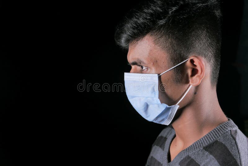 Side View of Young Man with Protective Mask Isolated on Black Stock ...