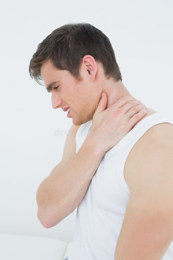 Side View of a Young Man Suffering from Neck Pain Stock Photo - Image ...