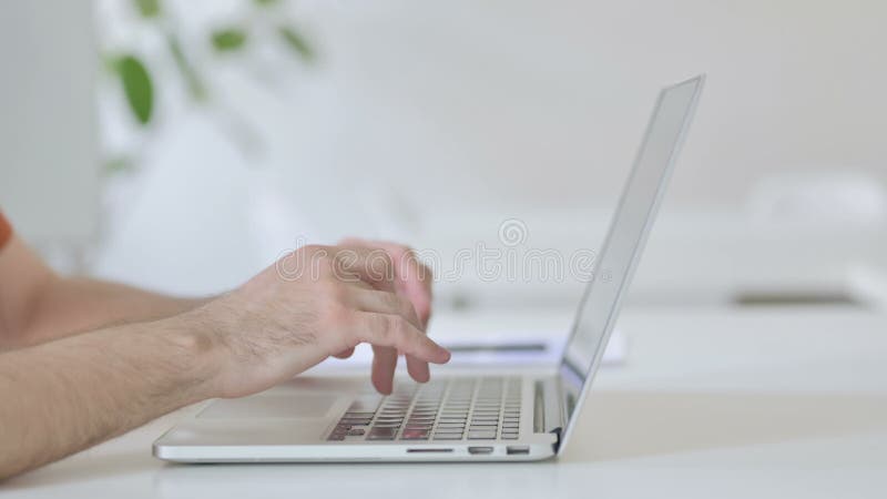 Side View of Businessman Using Mouse and Typing on Desktop Keyboard ...