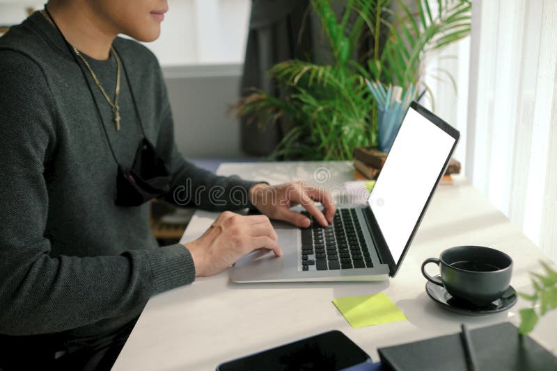 Young Man Using Computer Laptop while Sitting at Comfortable Workplace ...