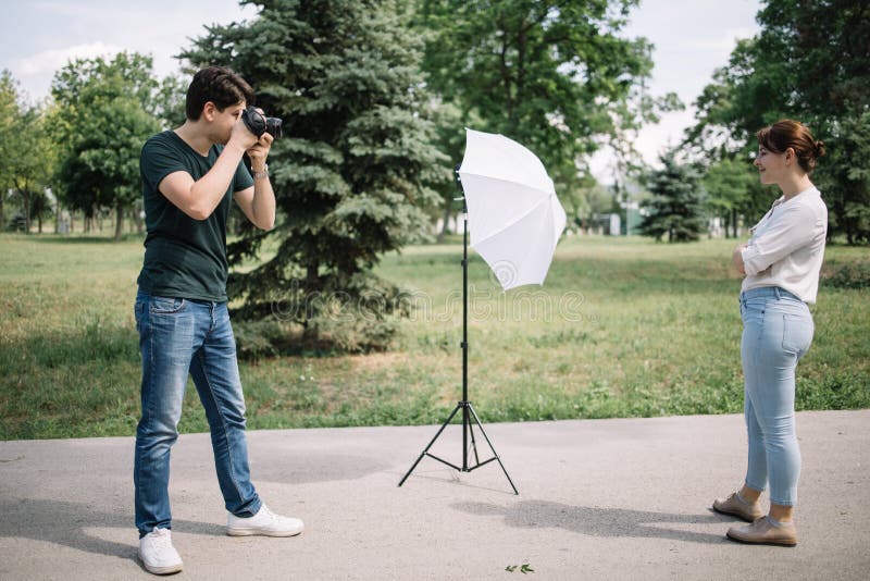Side View of Young Man Working with Professional Model Stock Photo ...