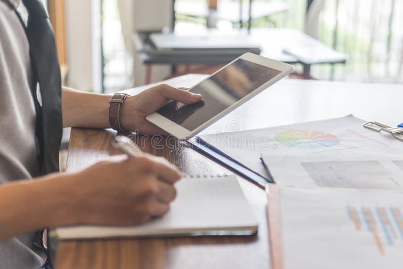 Side View of Young Man Writing Notes in Office Stock Image - Image of ...