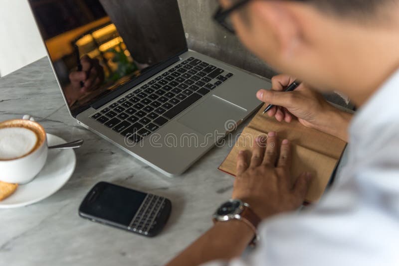Side View of Young Man Writing Notes Stock Image - Image of ...