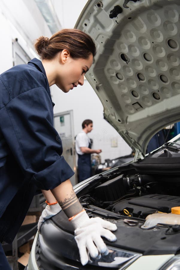 Side View of Young Mechanic Looking Stock Photo - Image of caucasian ...
