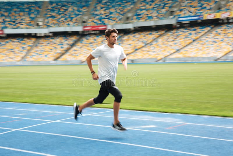 Side View of a Young Professional Sprinter Running Stock Image - Image ...