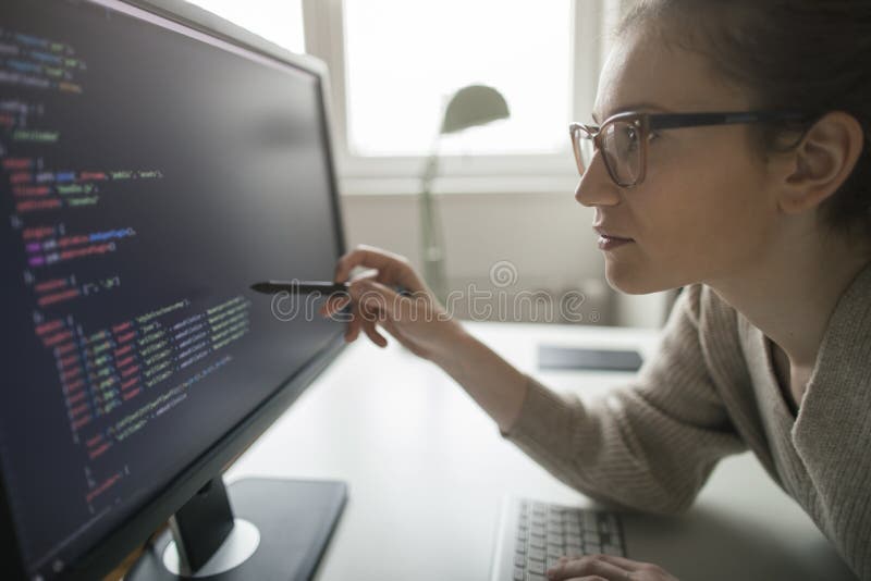 Side View of Young Programmer Working on Computer Codes from Her Home ...