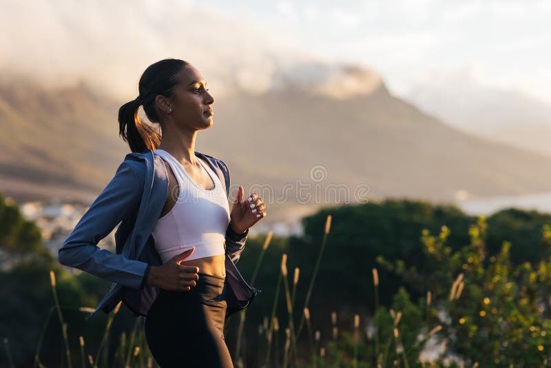 Side View of a Young Slim Female Jogging Outdoors Stock Image - Image ...