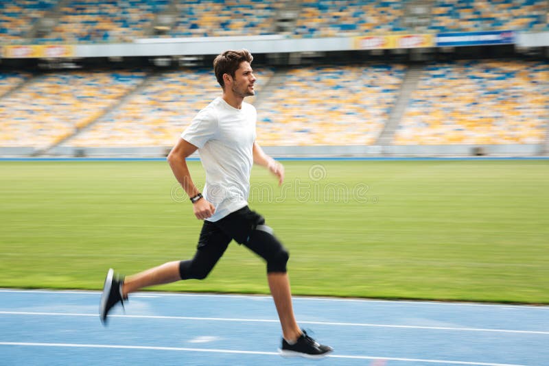 Side View of a Young Sportsman Running on a Racetrack Stock Image ...