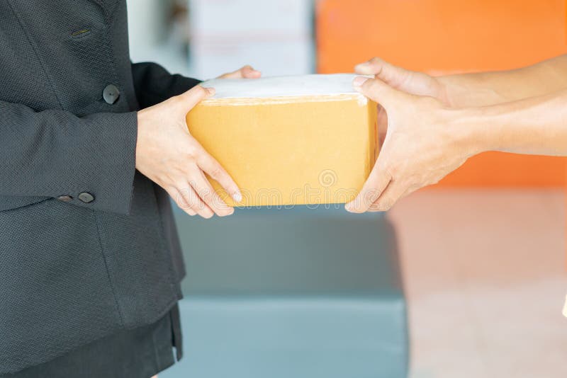 Side View of Young Woman Hand Receive a Cardboard Box from Delivery ...