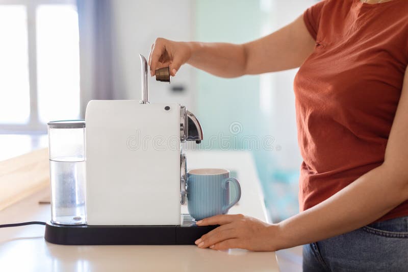 Side View of Woman Inserting Coffee Capsule in Espresso Machine in ...